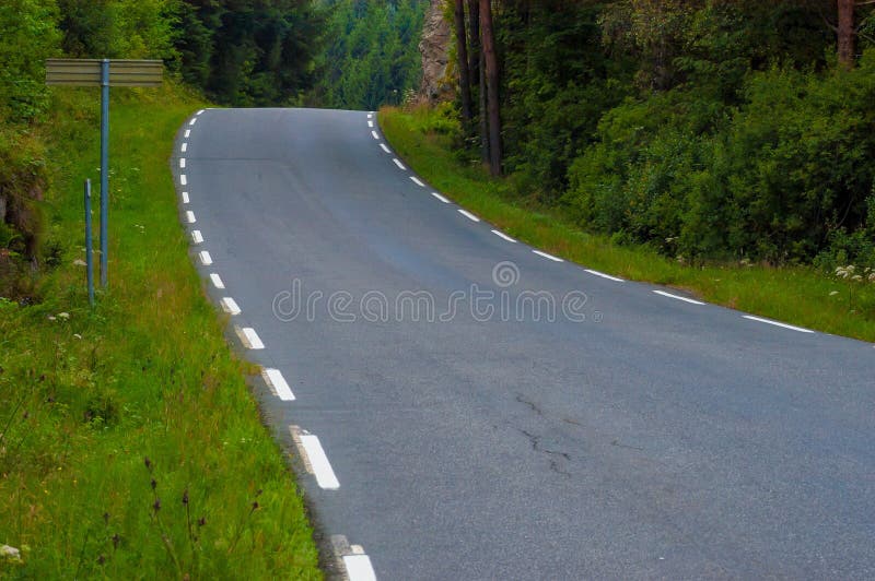 A Winding Road Over a Crest Stock Photo - Image of green, highway ...