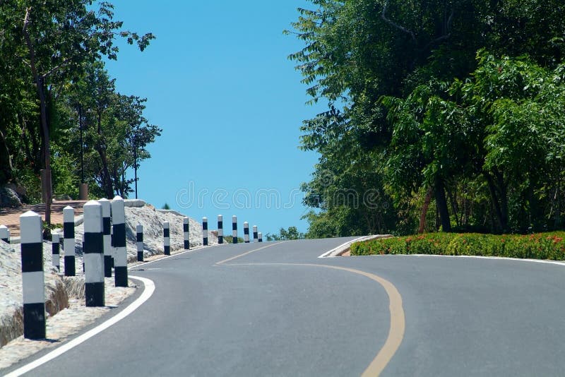 Winding road over a hill stock image. Image of colorful - 1198685