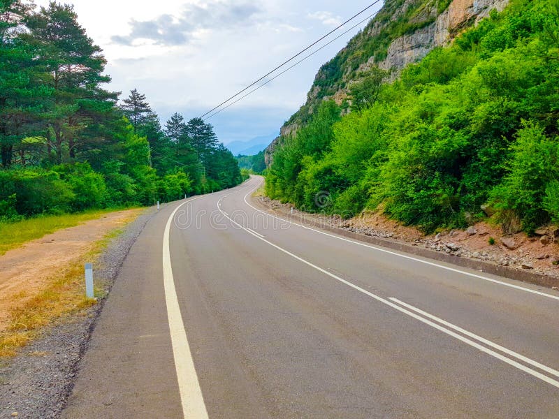 Winding Road on the Right and Vegetation on the Roadsides Stock Image ...