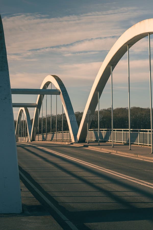 Winding Road Stretches Across an Arched Bridge at Sunset Stock Image ...