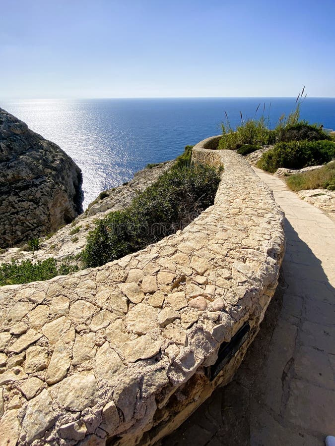 Winding Stone Wall and Walking Path Along the Ocean Stock Photo - Image ...