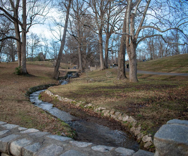 Winding Stream with a Stone Bridge in Foreground Stock Image - Image of ...