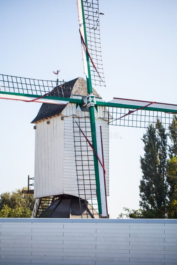 Windmill amongst the trees stock photo. Image of landmark - 91473176