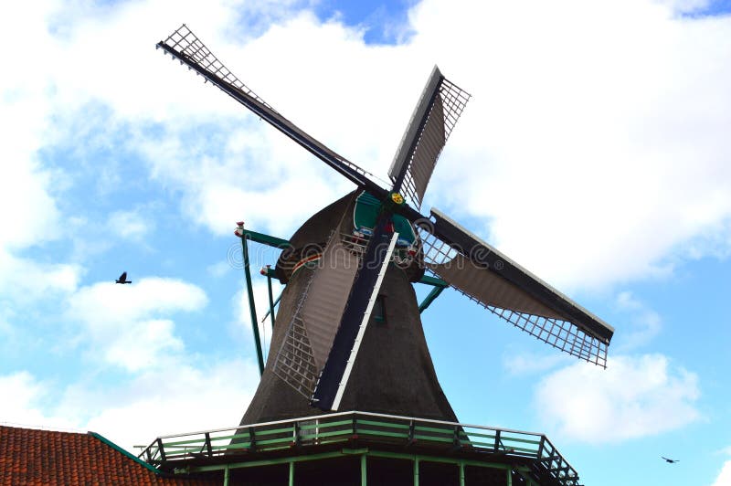 Windmill in Amsterdam stock photo. Image of green, clouds - 84934234