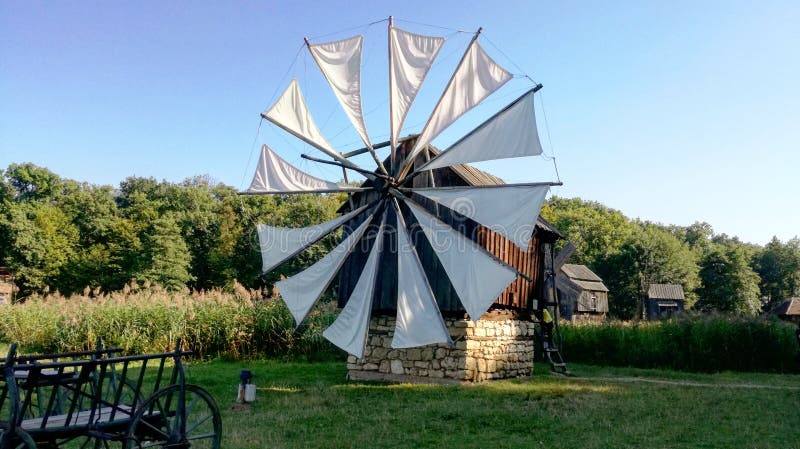 Windmill in a bath of sun editorial photography. Image of summer ...