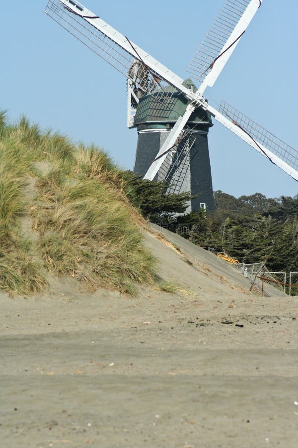 Windmill on beach stock photo. Image of windmill, wind - 33628774