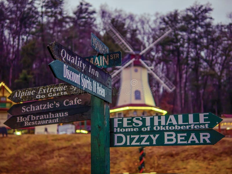 Windmill Behind the Road Sign Sunset Stock Photo - Image of person ...