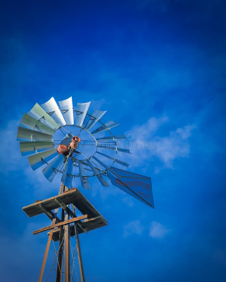Windmill with Blue Cloudy Sky Stock Photo - Image of power, clouds ...