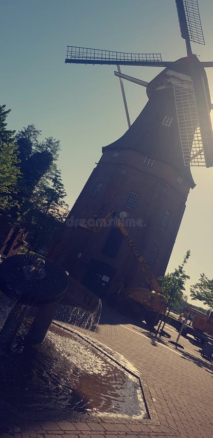 Windmill in the city editorial stock image. Image of windmill - 189926474