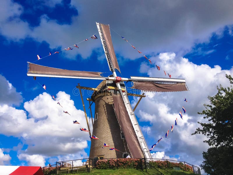 Famous Old Dutch Windmill And Flag Of Netherlands Stock Photo - Image ...