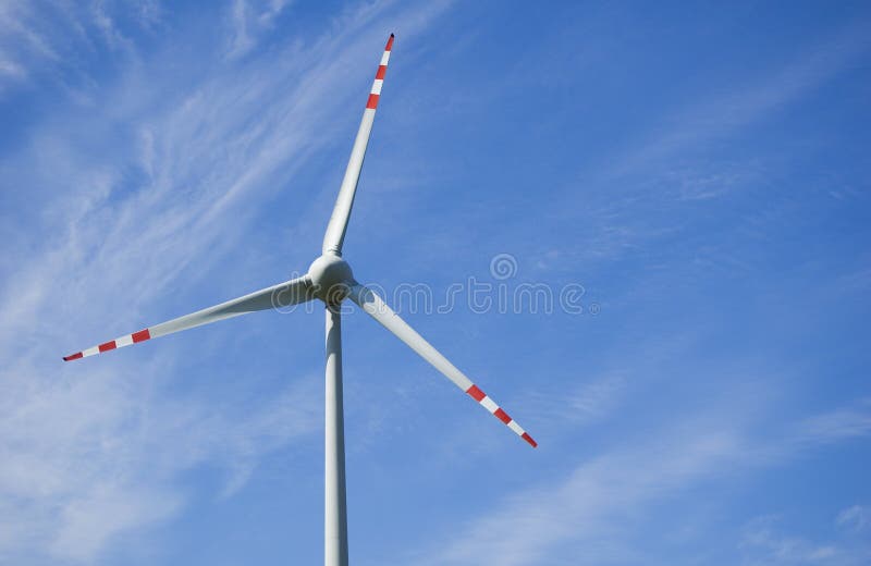 Windmill for Electric Power Production Against Blue Sky. Stock Photo ...