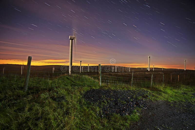 Windmill farm at night stock photo. Image of rural, long - 21851668