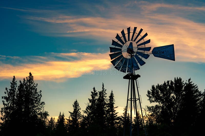 A Windmill is on a Farm and Some Trees is in the Back Ground Editorial ...