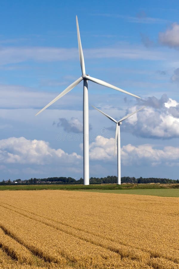 Windmill on a field stock photo. Image of blue, power - 42166918