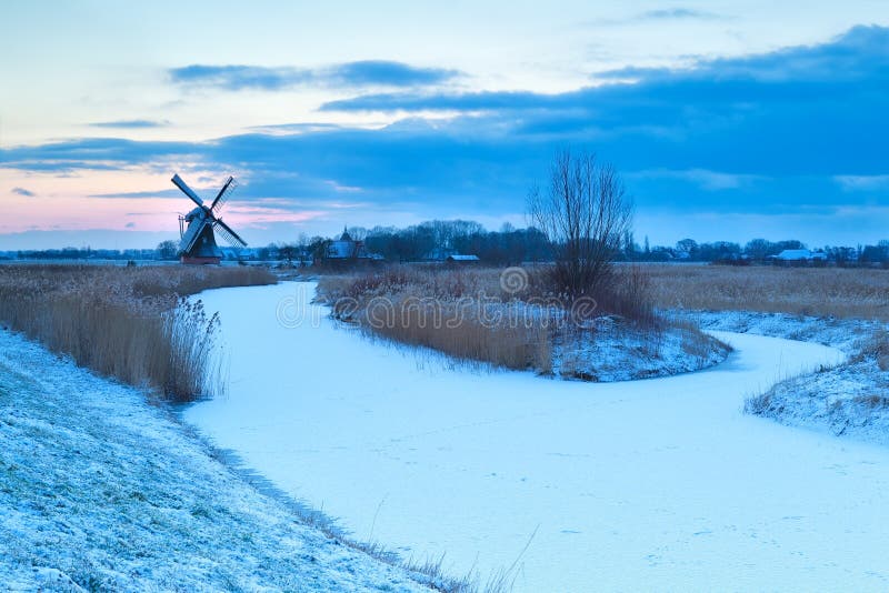 Windmill in the Snow stock photo. Image of farm, agriculture - 139962106