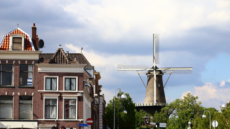 Windmill in historic city stock image. Image of skies - 41035211