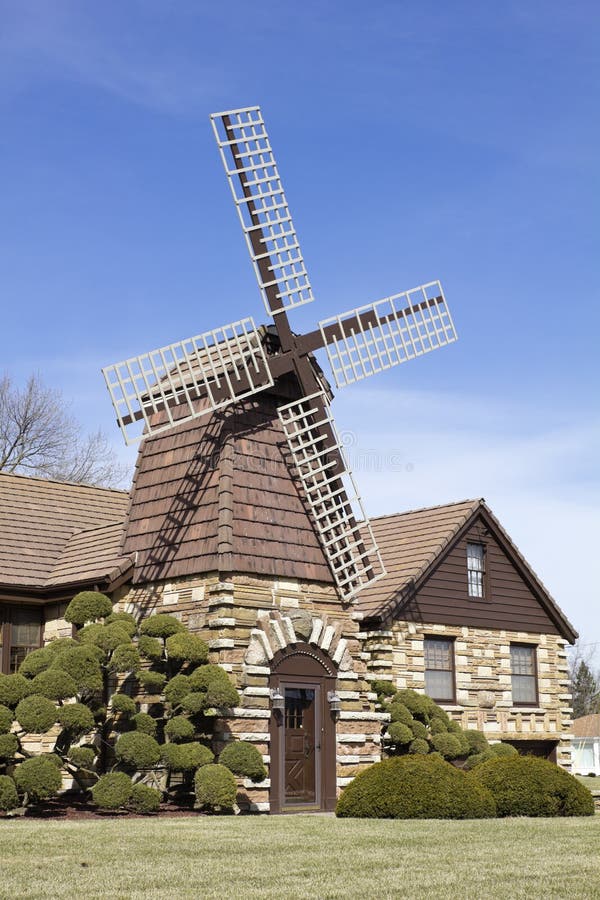 A Windmill with House in Holland Under a Dramatic Sky Stock Photo ...