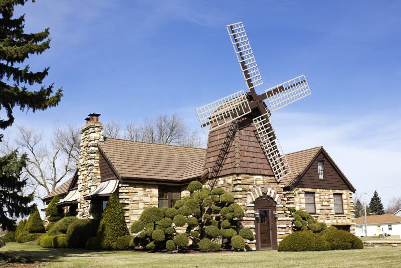 A Windmill with House in Holland Under a Dramatic Sky Stock Photo ...