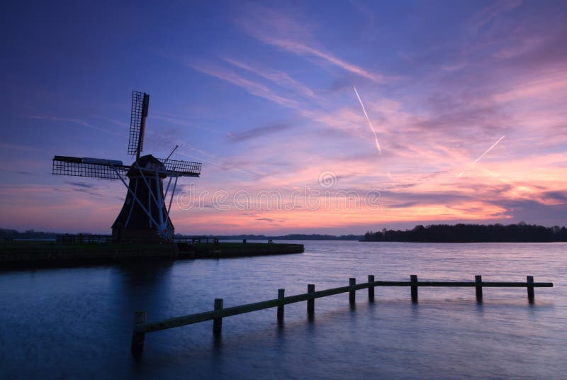 Windmill and lake stock image. Image of aeration, pond - 114347269