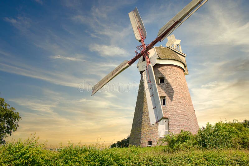 Windmill Located on a Field in the Sunset Stock Photo - Image of ...