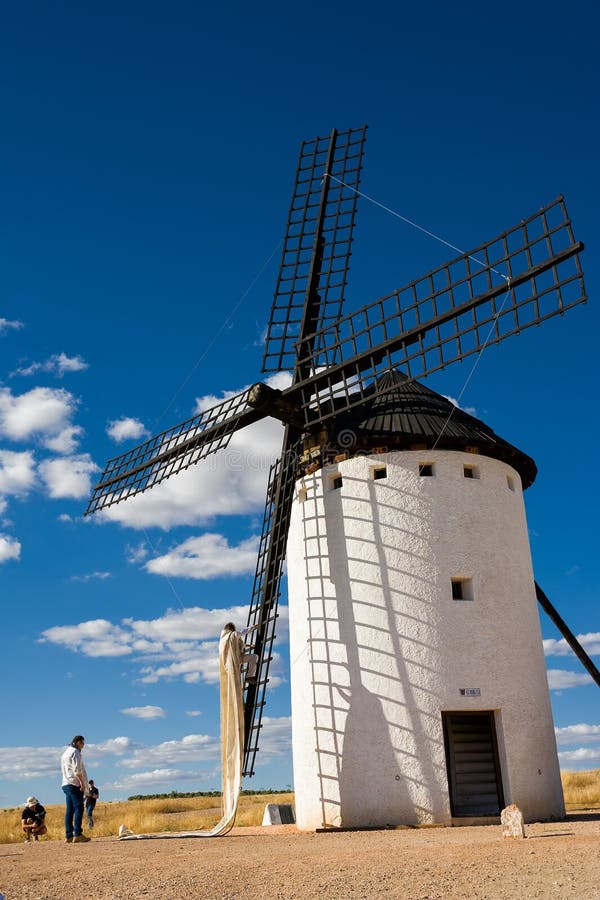 Windmill with Man Climbing on the Blades To Install the Tarp To Make it ...