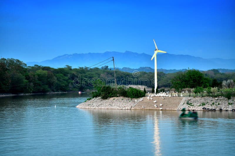 Windmill near a river stock photo. Image of pond, landscape - 39759192