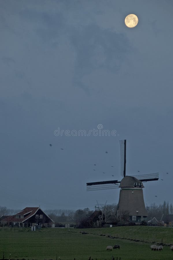 An Old Windmill in the Night with Clouds Stock Photo - Image of night ...