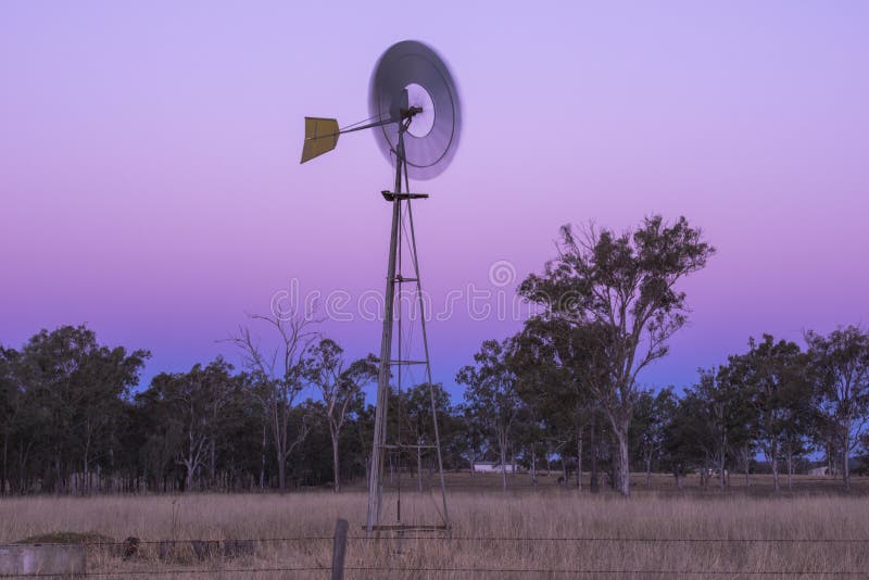 Windmill in a paddock stock photo. Image of australia - 100555450