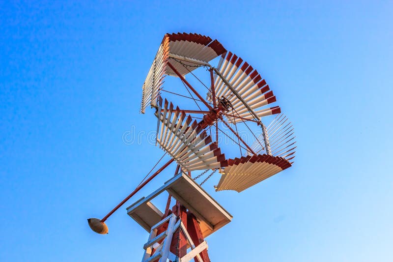 A Windmill is on a Pole in the Sky Stock Image - Image of pole ...