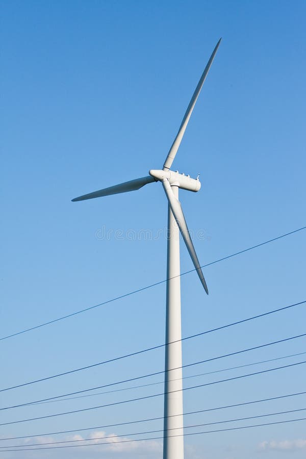 Windmill and powerlines stock image. Image of environment - 9434863