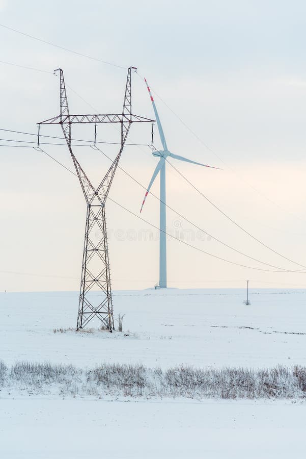 Windmill and Powerlines on the Field in Winter Stock Photo - Image of ...