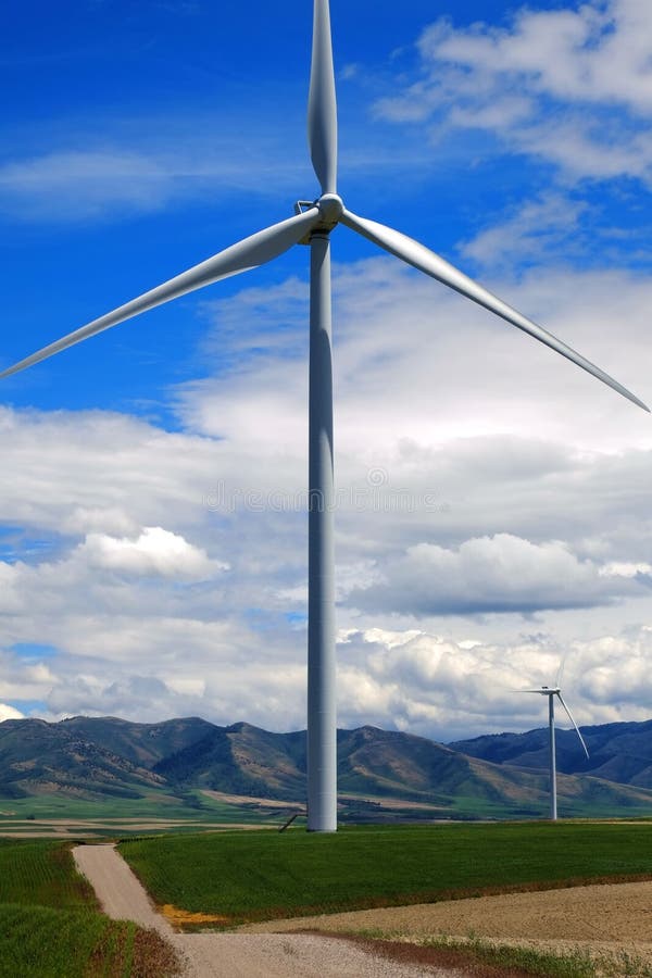 Windmill Producing Electricity with Blue Sky and Clouds Stock Image ...