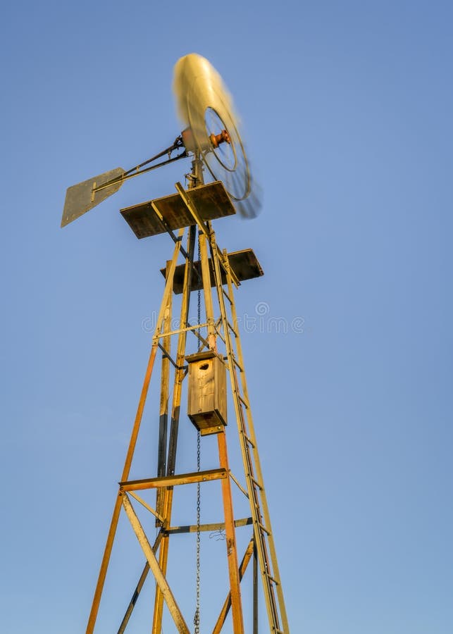 Windmill, Water Pump and Concrete Tank in Shortgra Stock Photo - Image ...