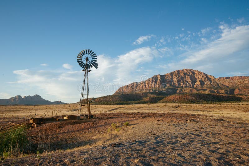 Windmill on Ranch Land stock photo. Image of barbed, colorful - 54563450