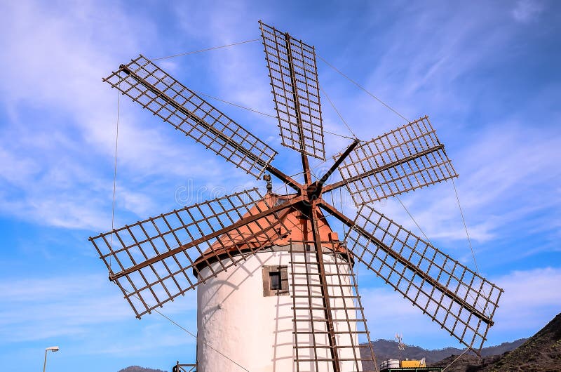 A Windmill with a Red Roof is Standing in a Field Stock Image - Image ...