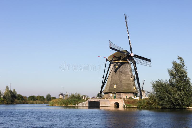 Windmill on the river stock photo. Image of flood, agriculture - 25103790