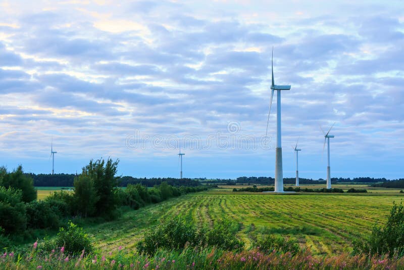 Windmill on Rural Field in the Sunset. Wind Turbines Farm. Stock Photo ...