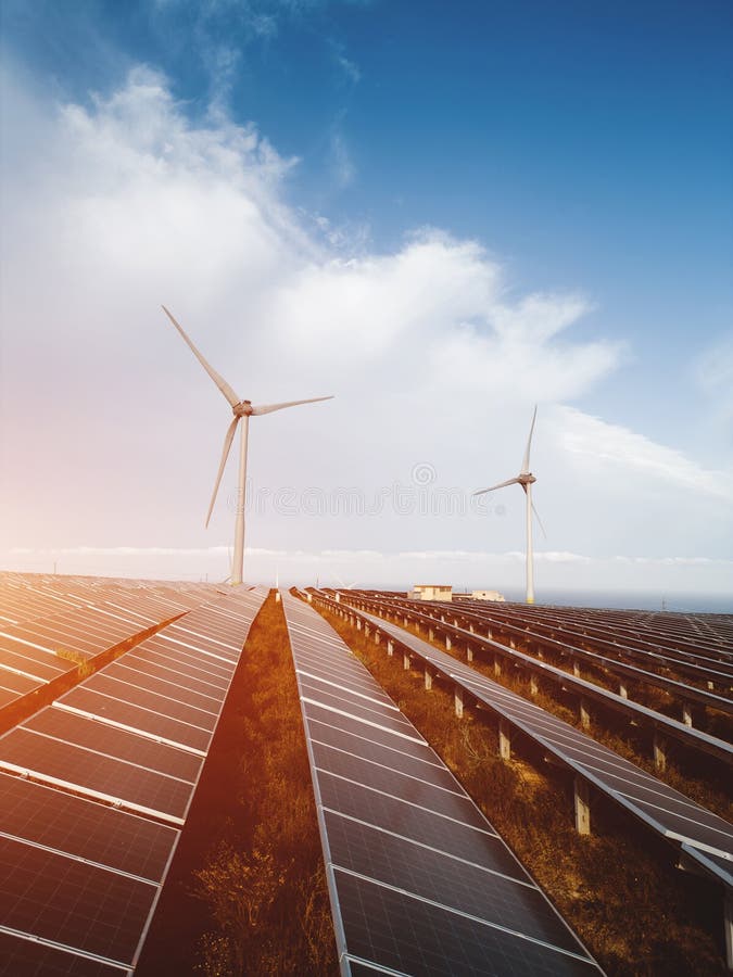 Windmill And Solar Panel Farm Producing Renewable Energy With Wind And