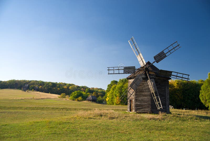 Windmill Standing in the Field Against the Blue Sky Stock Image - Image ...