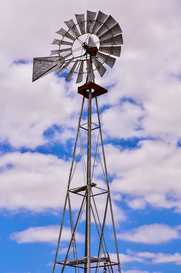 A Windmill is Standing Tall in the Sky Stock Photo - Image of ...