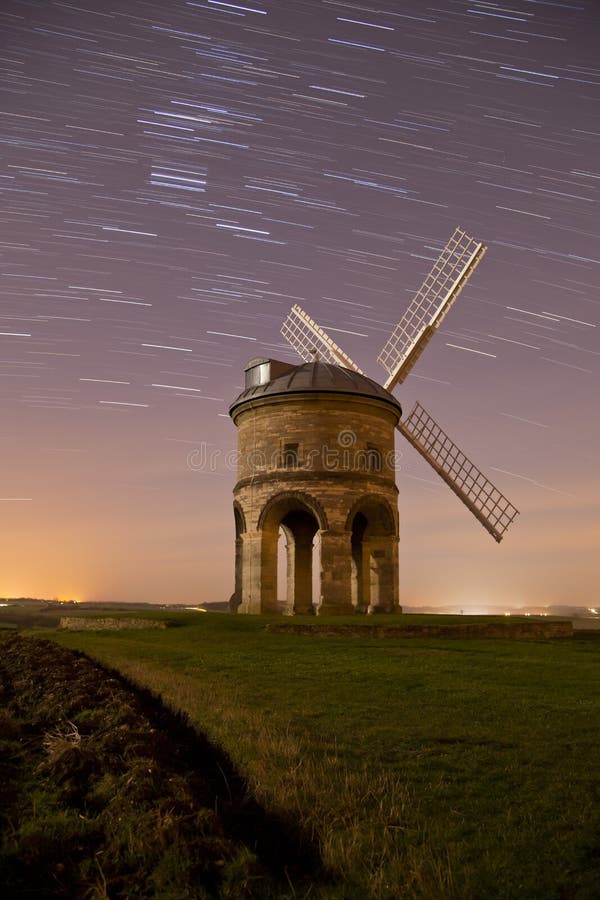Windmill with star trails stock image. Image of building - 22933321
