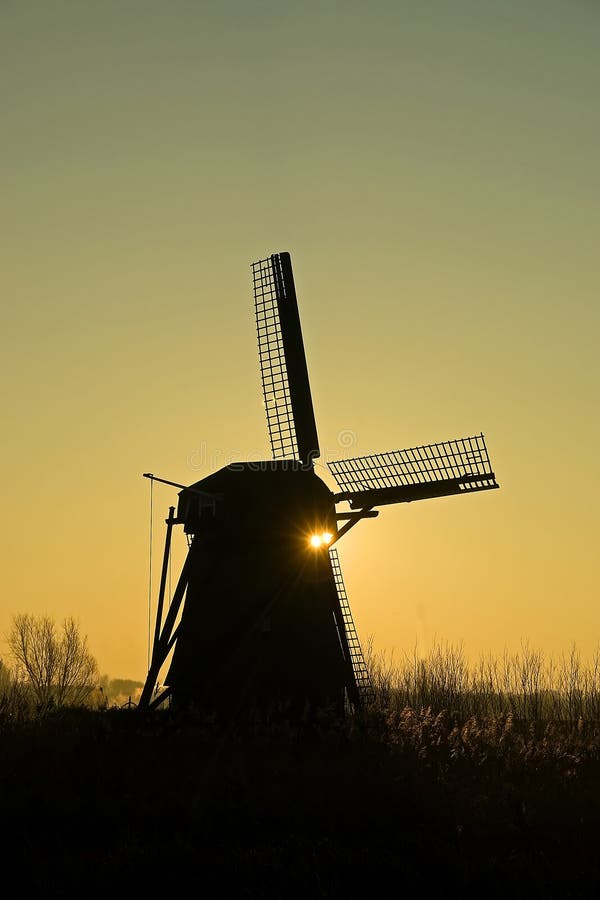 Windmill at sunrise stock image. Image of netherlands - 10805653