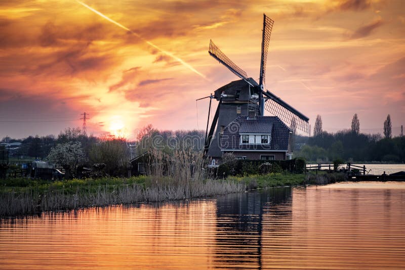 Windmill at sunset stock photo. Image of architecture - 151972264