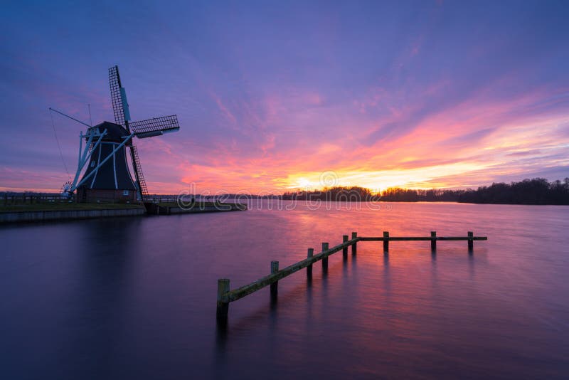 Windmill Sunset at the Lake Stock Image - Image of frosty, countryside ...