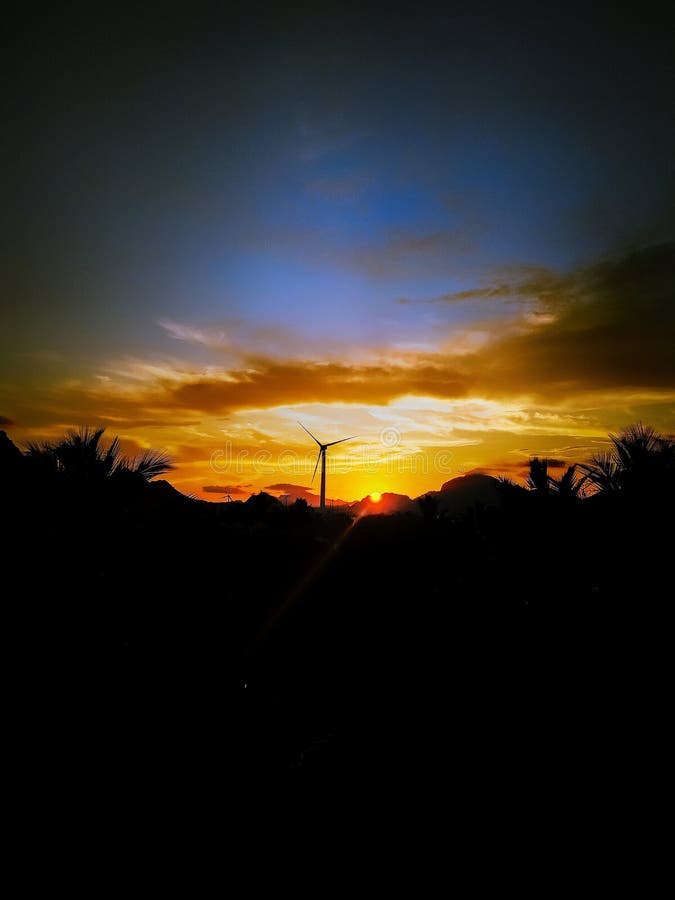 Windmill at Sunset stock photo. Image of silhouette - 191360776
