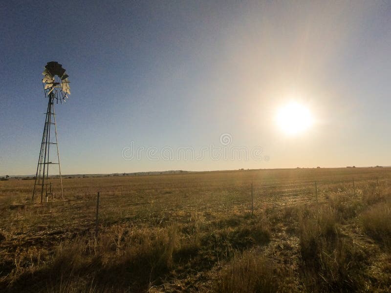 Windmill in the sunset sun stock photo. Image of explore - 113116632
