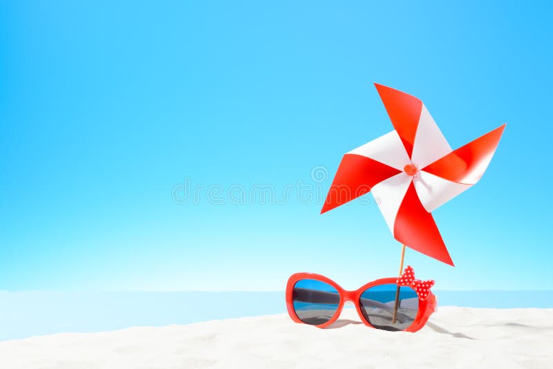 Windmill Toy and Sunglasses on the Sandy Beach Stock Photo - Image of ...