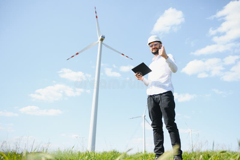Windmill Turbine Maintenance Engineer Standing at Wind Farm. Stock ...