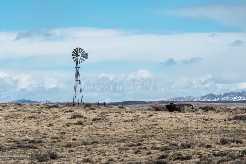 Windmill in Utah stock photo. Image of grass, tank, clouds - 92804212
