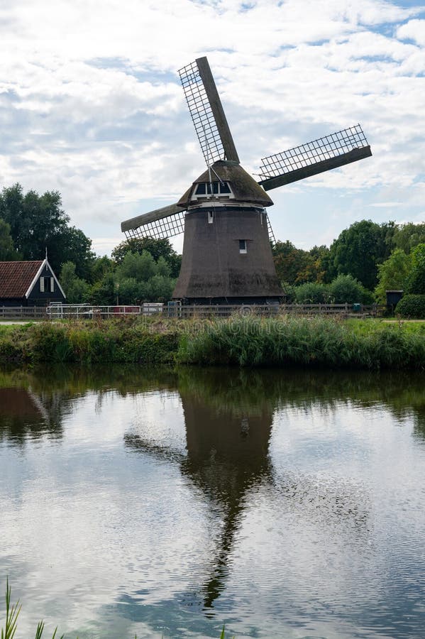 A Windmill on the Water in the Netherlands Stock Photo - Image of north ...